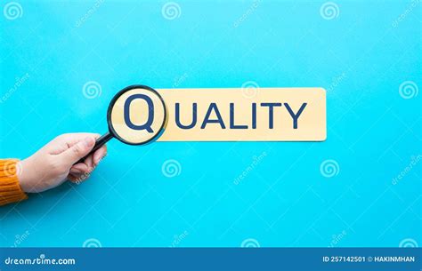 Quality And Analysis Concepts With Person Hand And Magnifying Stock