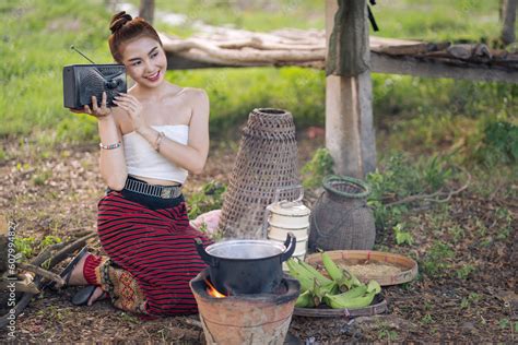 Beautiful Asian Girl Wearing Traditional Thai Dress In The Countryside