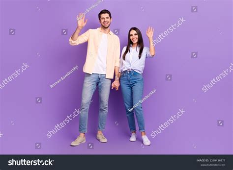 Two People Waving Hello
