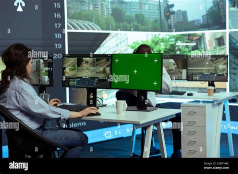 Operator Monitors Traffic Next To An Isolated Mockup Display Following Real Time Surveillance