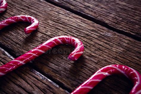 Pink Candy Canes Arranged On Wooden Plank Stock Photo Image Of Arrangement Decoration