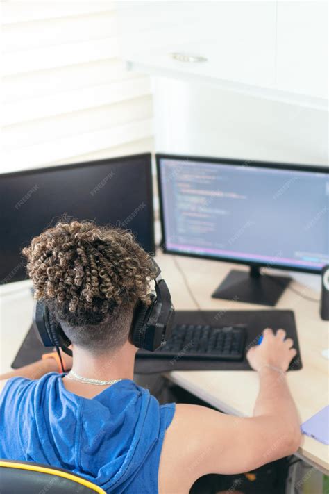 Premium Photo From Above Software Engineer Sitting At Desk And Typing On Computer Keyboard