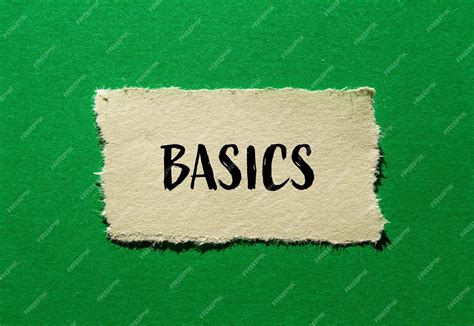 Premium Photo Basics Word Written On Ripped Paper With Green