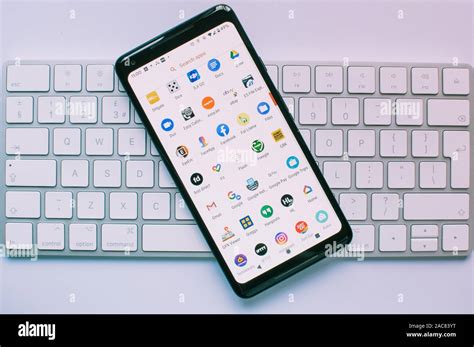 Android Phones On Apple Keyboard Stock Photo Alamy