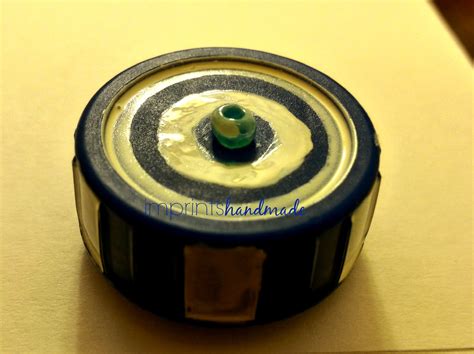 Imprints Handmade Simple Spinning Top With Bottle Caps Diy