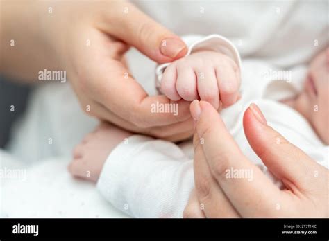 Mother S Finger Embraced By Newborn S Gentle Grip Unveils Emotions Concept Of Profound Maternal