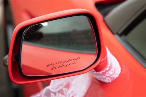 premium photo car side mirror arabic writing text means objects in