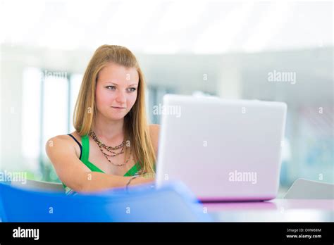 Pretty Female College Babe Working On Her Laptop Computer On Campus Before Class Color