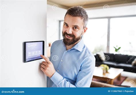 A Man Pointing To A Tablet With Smart Home Screen Stock Photo Image