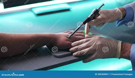 Crop Scientist Implanting Microchip Into Hand Of Patient Stock Video