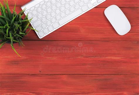 Office Desk With Copy Space Digital Devices Wireless Keyboard And Mouse On Green Wooden Table