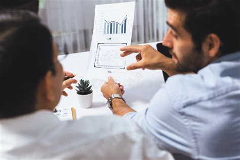 Analyst Team Utilizing Bi Fintech To Analyze Financial Data At Table