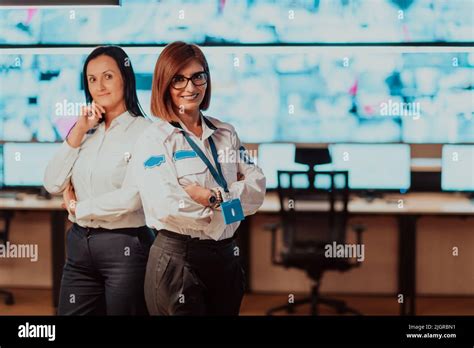 Group Portrait Of Female Security Operator While Working In A Data System Control Room Offices
