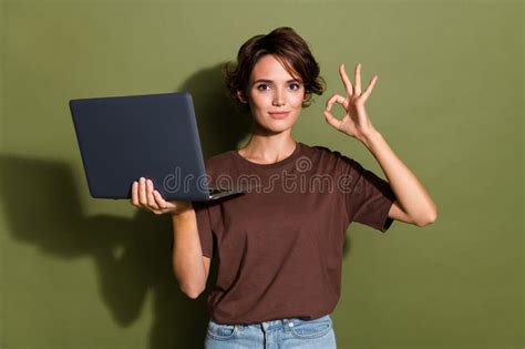 Photo Portrait Of Pretty Young Girl Show Okey Symbol Hold Netbook