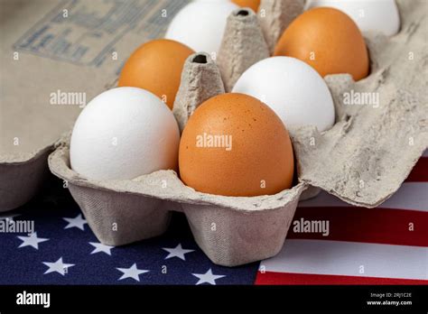 Carton Of White And Brown Eggs On United States Of America Flag