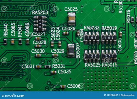 Macro Shot Of A Circuitboard With Resistors Microchips And Electronic Components Computer