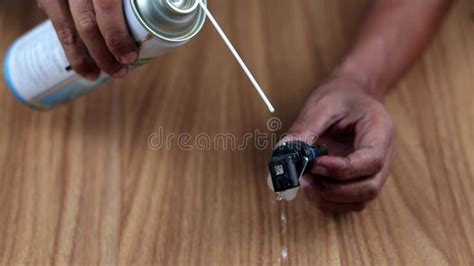 Close Up Hand Spray The Transmission Speed Sensor With Contact Cleaner Stock Video Video Of