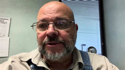 Man With Large Head At Doctors Office