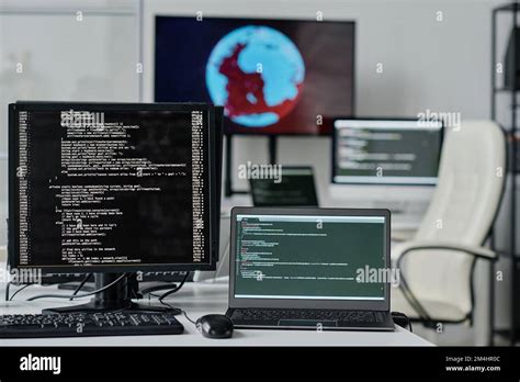 Close Up Of Computer Monitor With Codes On The Screen Standing On Table