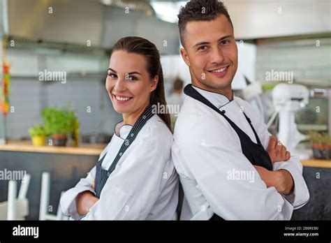 Female And Male Chefs In Kitchen Stock Photo Alamy