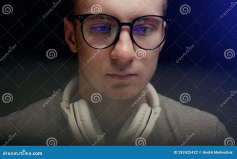 Concentrated Young Professional Programmer in Computer Glasses with Monitors Reflection Works ...