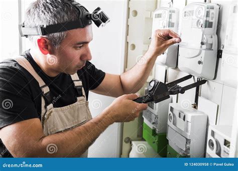 Electrician Testing Equipment In Fuse Switch Box Close Up Stock Photo Image Of Assembling