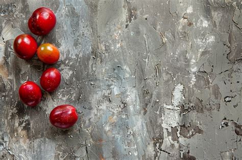 Oblong Tomatoes On A Grey Grunge Wall Premium Ai Generated Image