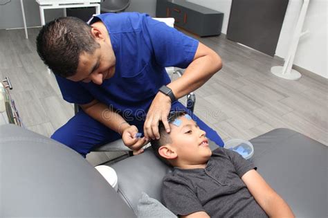 Electroencephalogram To Record The Electrical Activity Of The Brain Of A 9 Year Old Dark Skinned