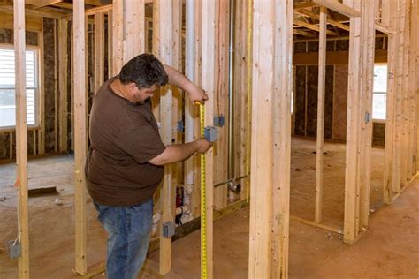 premium photo hands of electrician installing electrical socket in