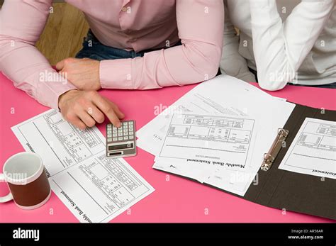 Couple With Bank Statements Stock Photo Alamy