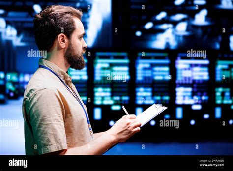 skilled domputer scientist setting up server hub advanced firewalls