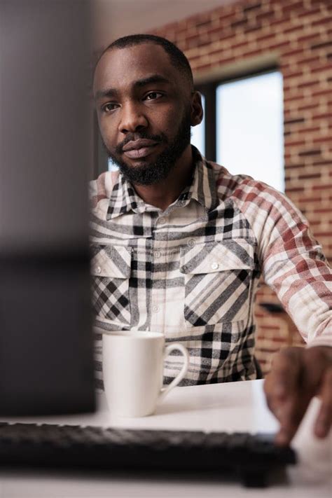 African American Software Developer Debugging Source Code Algorithm