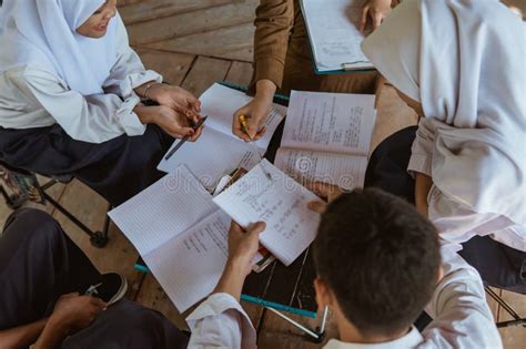 View From Above The Teacher Guides Students Doing Assignments Stock