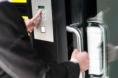 Unlocking The Door With A Security Code Man Inputs Access Code Photo