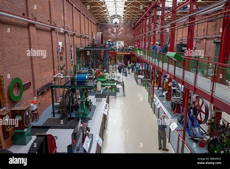 Industrial Steam Engine Museum Interior With Visitors Exploring Vintage Machinery Exhibits Stock