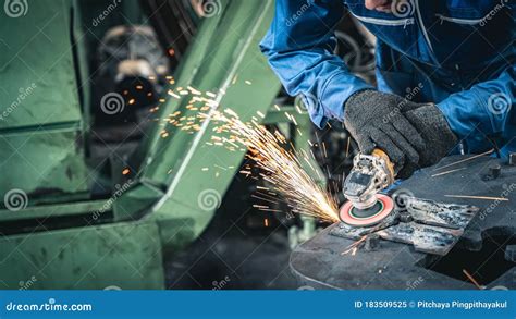 Factory Worker Using Grinder For Cutting Metal Stock Image Image Of