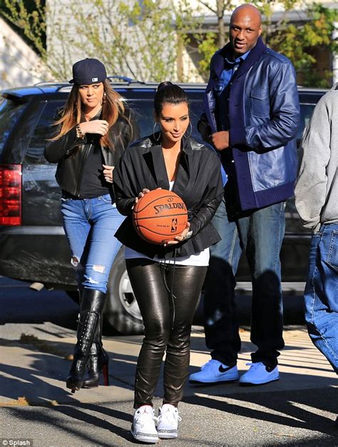 Khloe Kardashian Teeters Around The Basketball Court In Knee High Boots