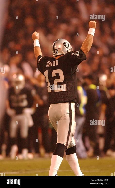 Oakland Raider Quarterback Rich Gannon Raises His Arms As Charlie