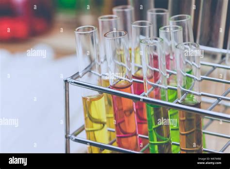 Stand With Test Tubes Isolated On White Several Chemical Solution In Flask Laboratory