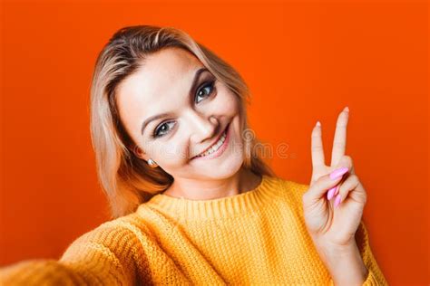 Cute Blonde Makes Selfie On The Front Camera The Portrait Stock Image