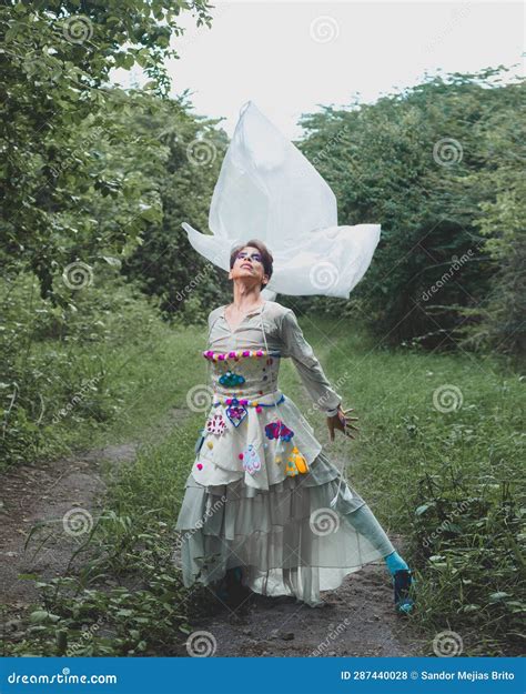 Portrait Of A Non Binary Gender Person Interacting With Nature Stock