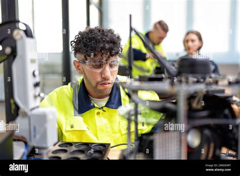 engineer learn basic theory how to operation maintenance and programing robot arm in training