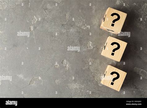Cubes With Question Marks On Grey Stone Table Flat Lay Space For Text Stock Photo Alamy