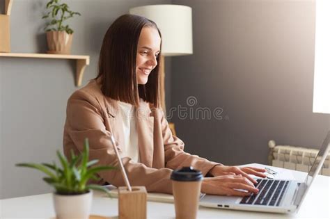 Side View Portrait Of Beauiful Young Woman Working Online Using Computer Laptop Concentrated