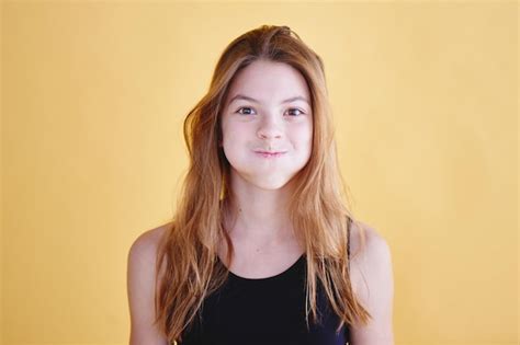 Premium Photo Young Girl With Closed Mouth Puffed Out His Cheeks
