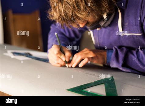 Boy Making Your Own Surfboard In A Workshop Stock Photo Alamy