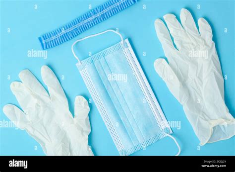 Medical Gear Protecting Against Transmittable Diseases On Blue Background Stock Photo Alamy