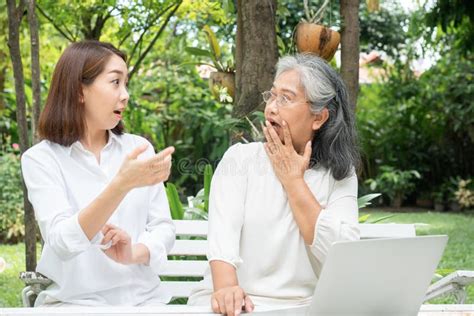 Asian Daughter Teaching Old Elderly Woman Use Online Social Media In Computer Laptop After