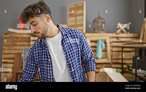 Handsome Serious Faced Young Arab Man A Master Carpenter Standing Tall Within His Buzzing
