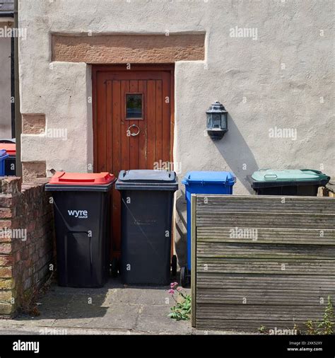Colour Code Wheelie Bins Outside Cottage Stock Photo Alamy